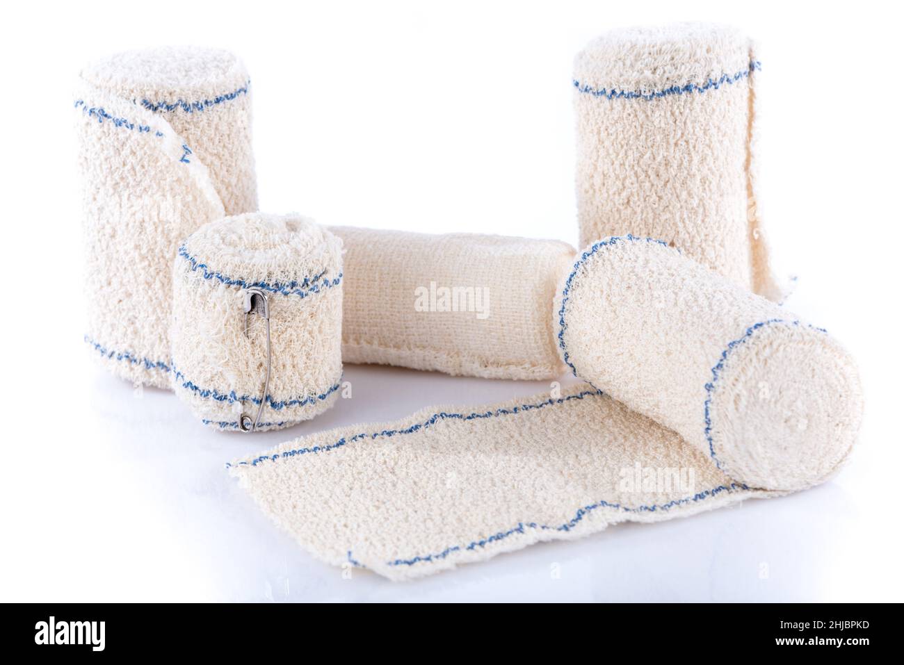 Rolls of medical bandages, isolated on white Stock Photo - Alamy