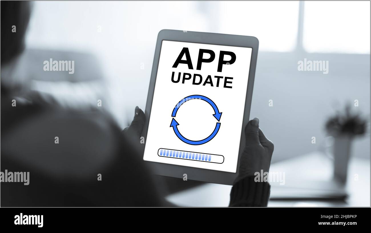 Tablet screen displaying an app update concept Stock Photo - Alamy
