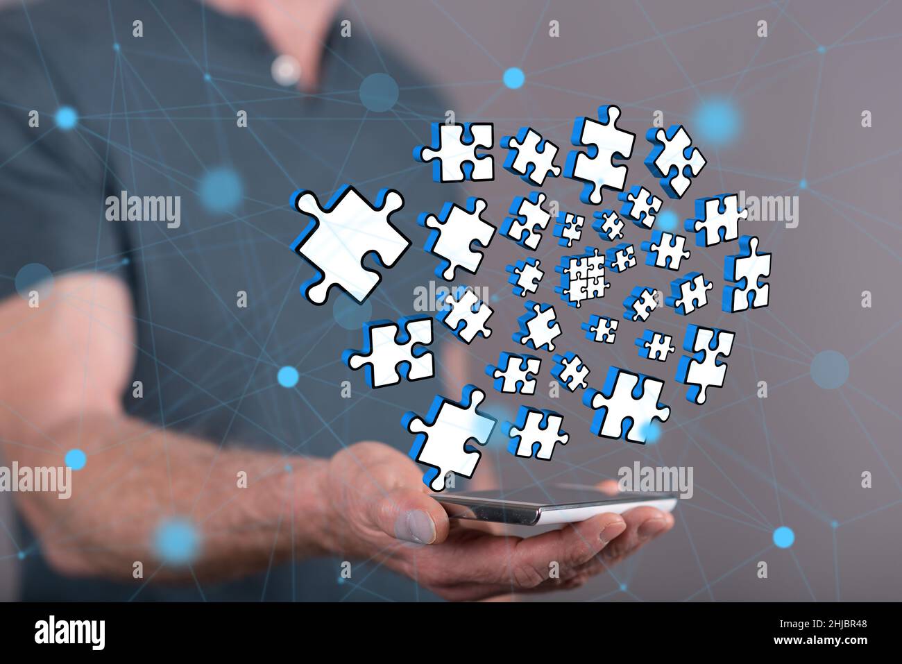 Teamwork concept above a smartphone held by a man in background Stock ...