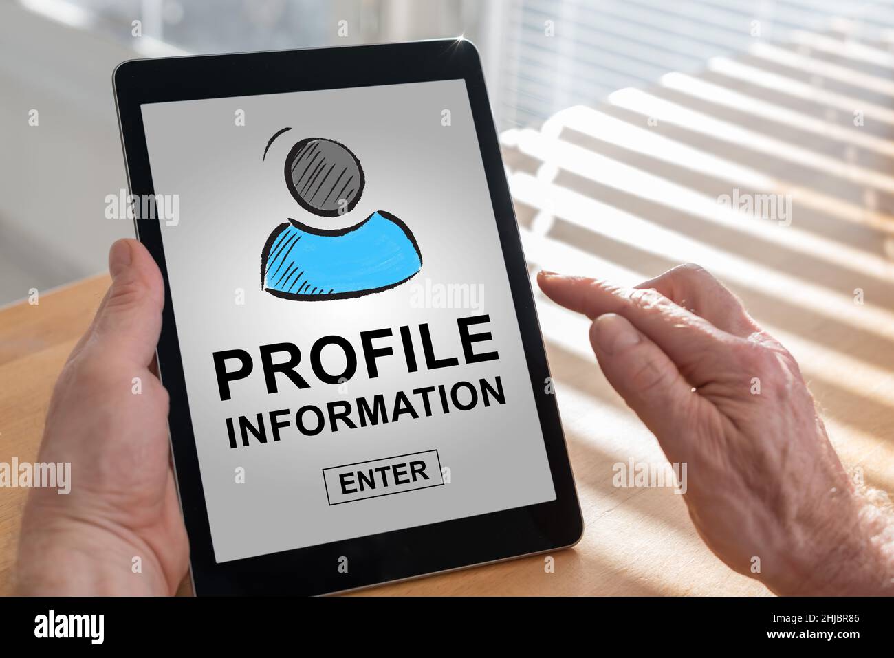 Tablet screen displaying a profile information concept Stock Photo - Alamy
