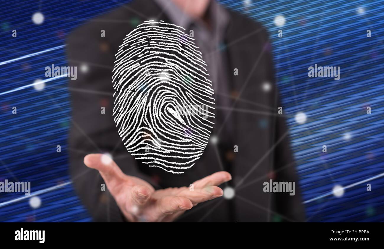 Fingerprint security system concept above the hand of a man in ...