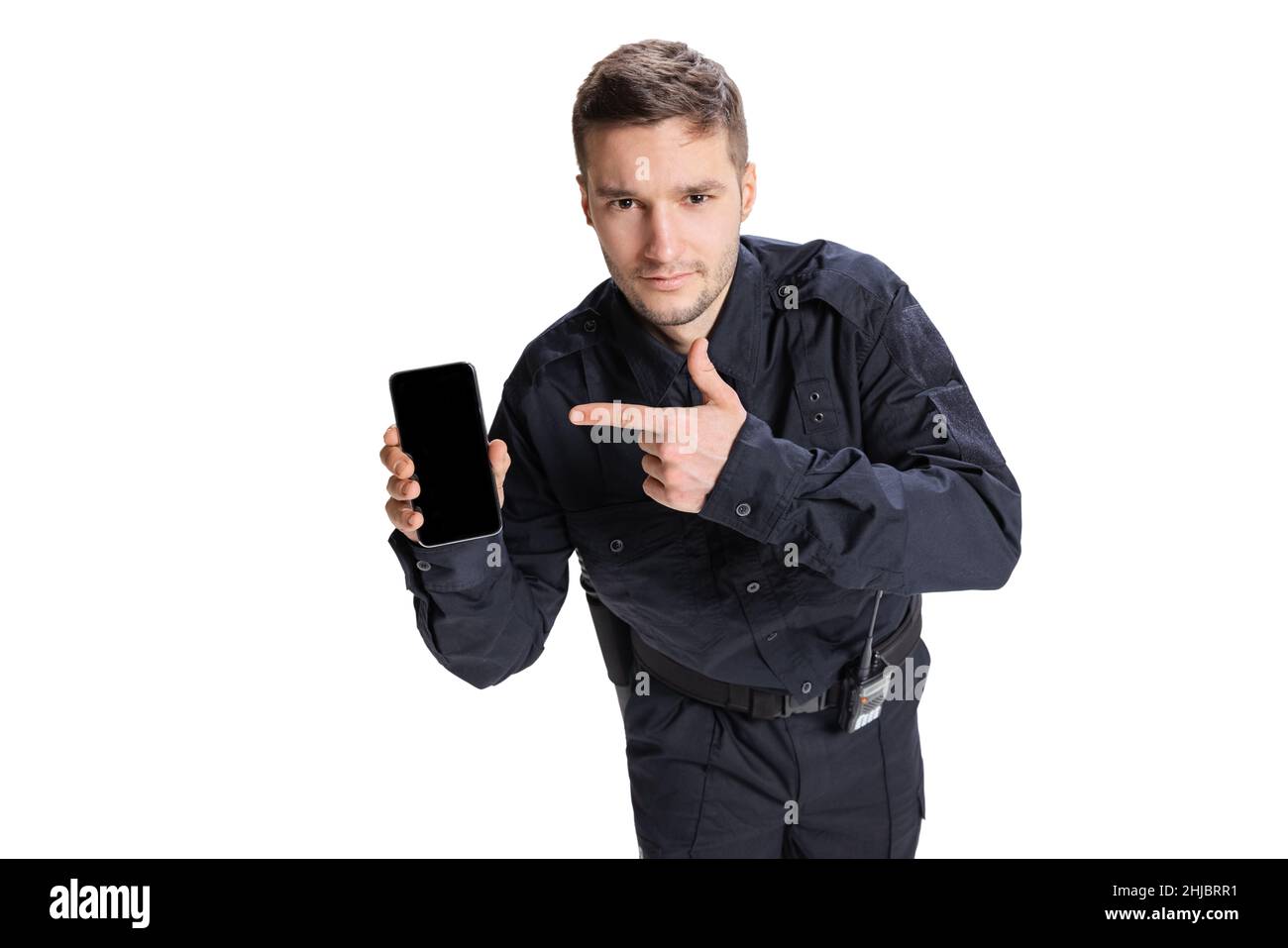 Portrait of young man, policeman officer wearing black uniform using ...