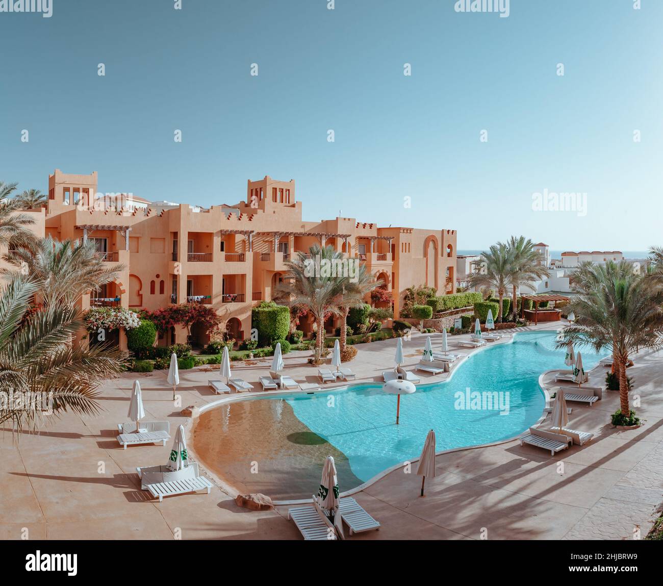Beautiful swimming pool and palm trees in Egypt Stock Photo - Alamy