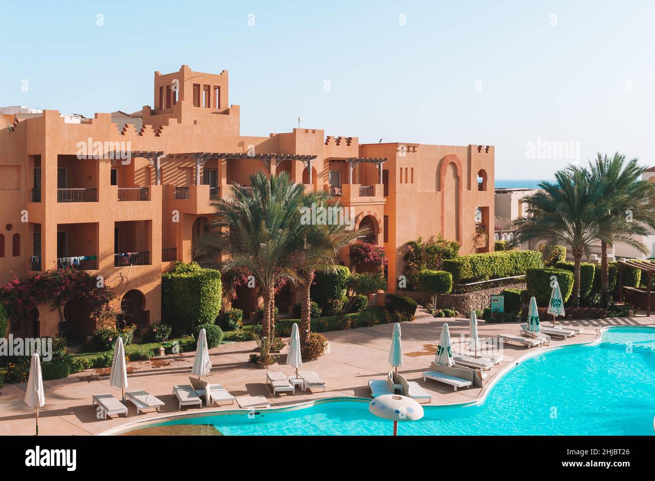 Beautiful swimming pool and palm trees in Egypt Stock Photo - Alamy