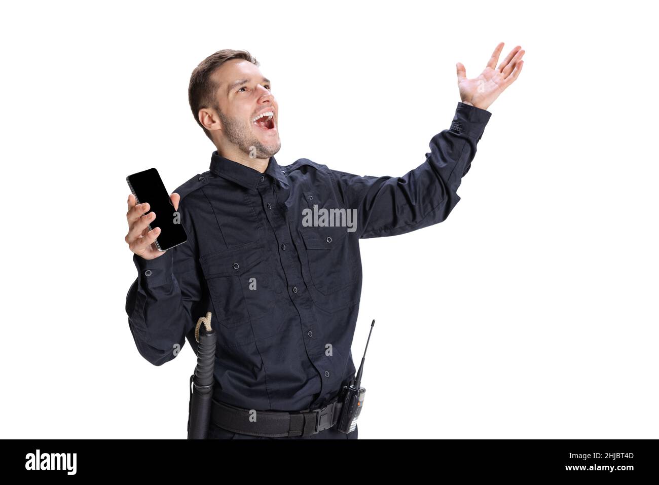Portrait of young excited man, policeman officer wearing black uniform ...