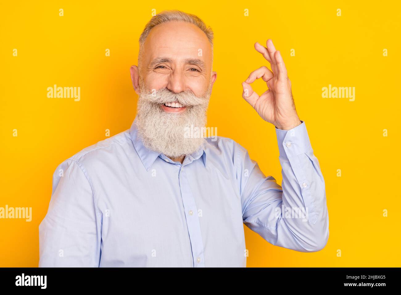 Photo of attractive happy old man smile good mood show okay sign agree ...