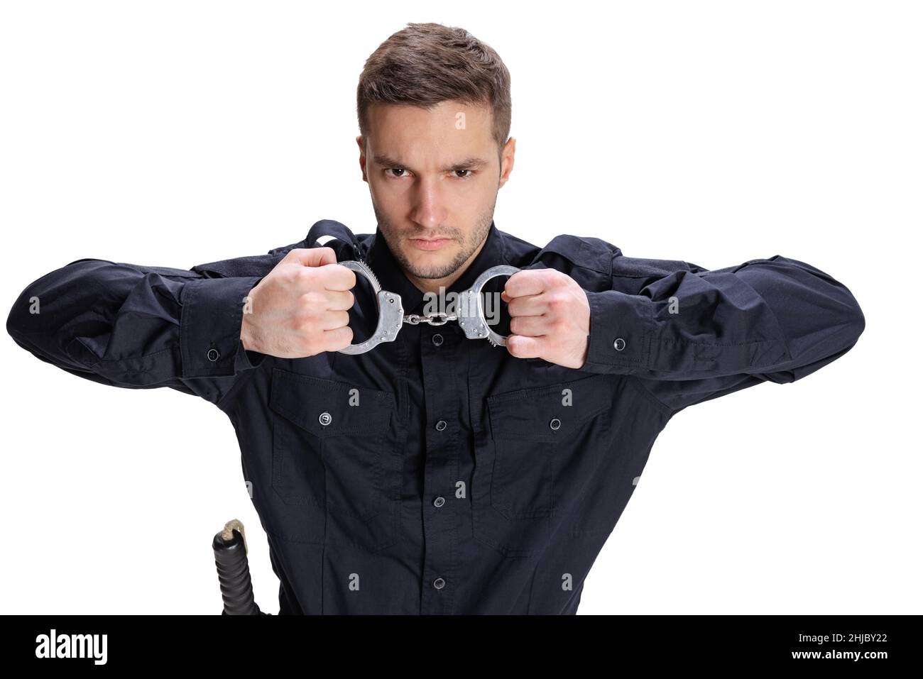Half-length portrait of young male policeman officer wearing black ...