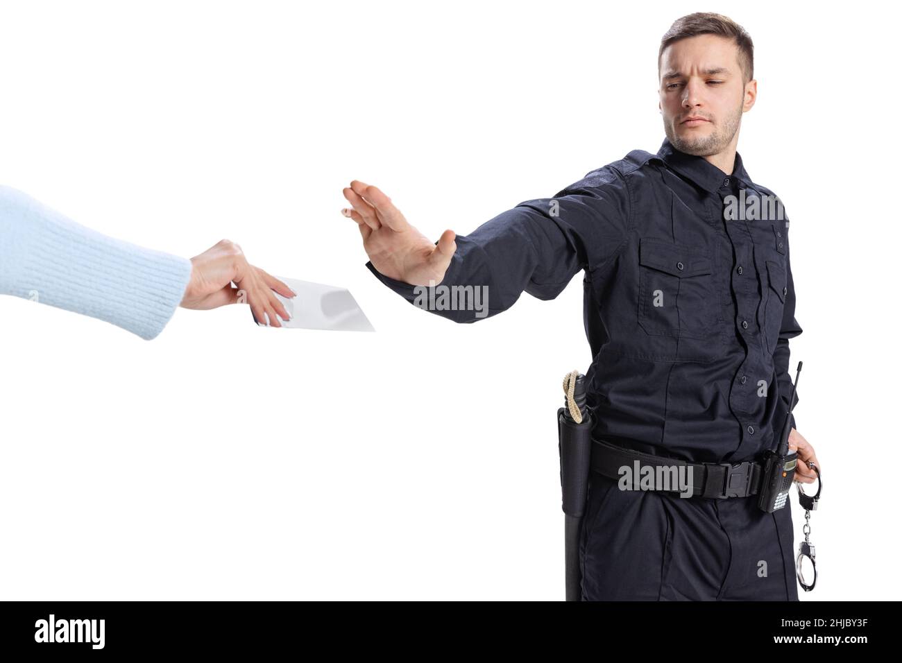 Portrait of young man, policeman wearing black uniform refuses a bribe ...