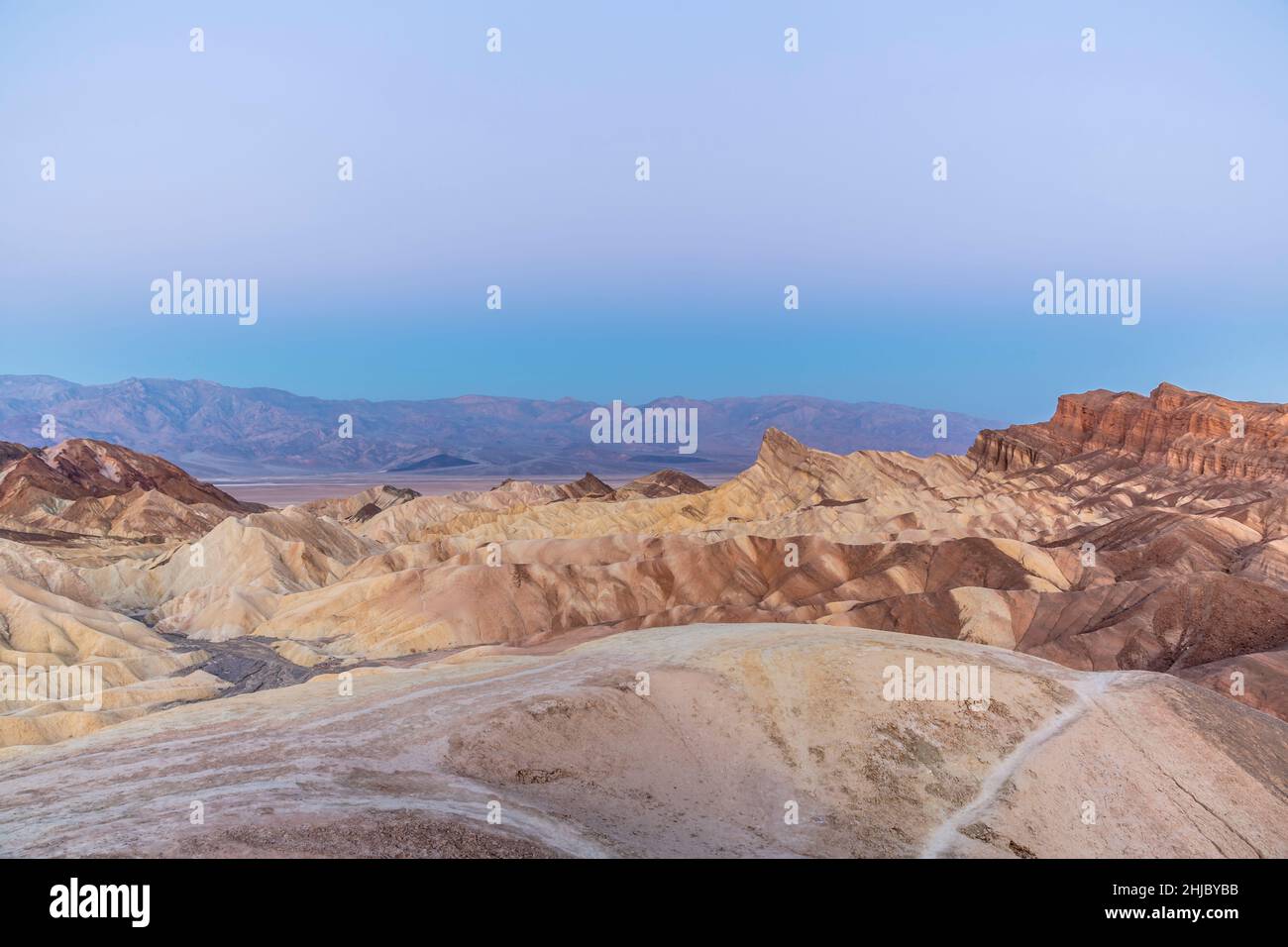 Scenery while sunrise in the Death Valley with rocks and desert in the ...