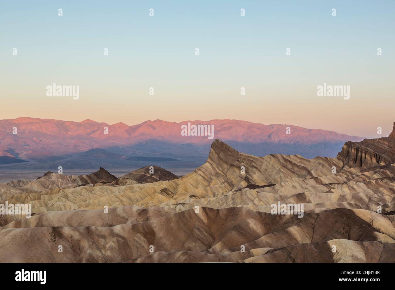 Scenery while sunrise in the Death Valley with rocks and desert in the ...