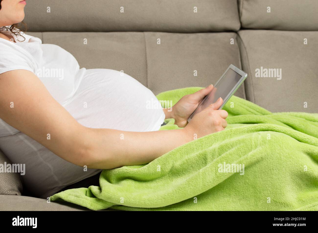 Pregnant woman looking digital hi-res stock photography and images - Alamy