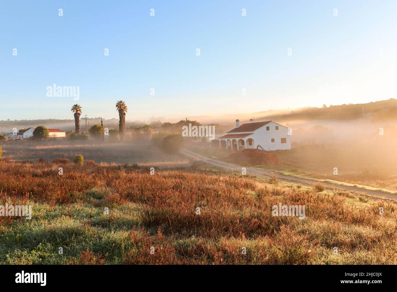 View of typical Alentejo landscape with Portuguese village in morning ...