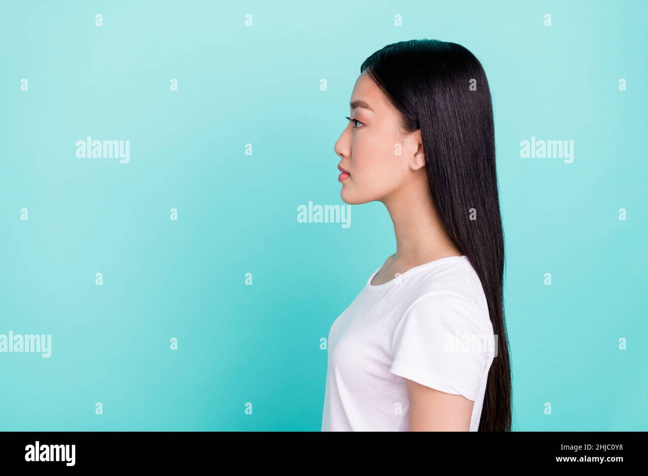 Profile side photo of young attractive asian girl look empty space ...