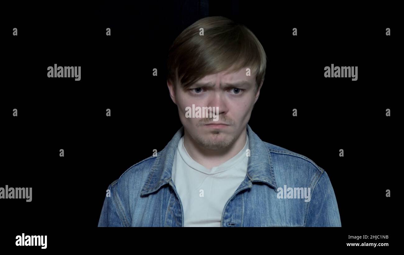 Young man feeling sad. Cute man sad with disturbed expression. Human ...