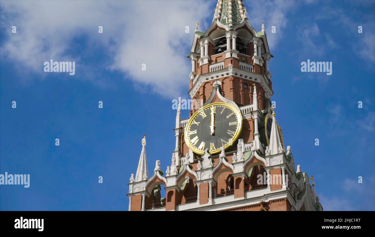 Red Kremlin fortress and Spasskaya tower on background of blue sky ...