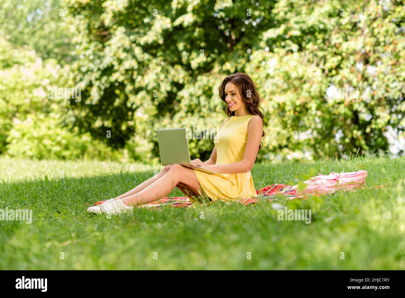 Full length profile side photo of young attractive woman happy positive smile chat type study ...