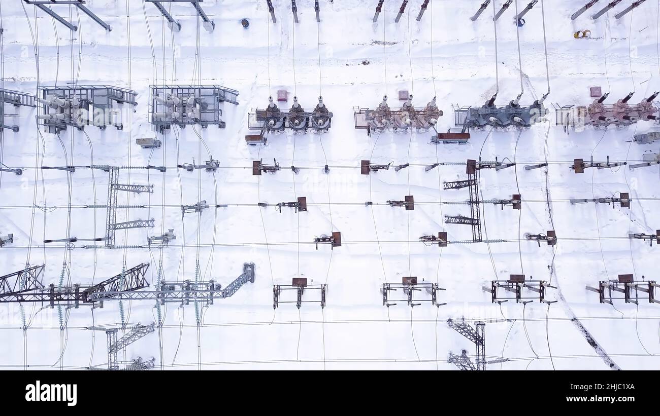 Rows of electric poles. Action. Top view of electrical substation with ...