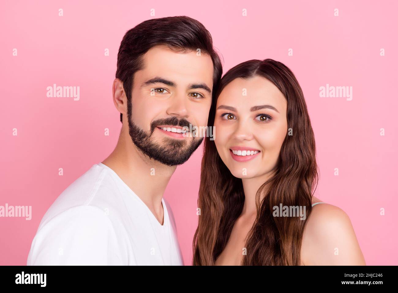 Photo of positive couple lean together touch cheeks white smile wear ...