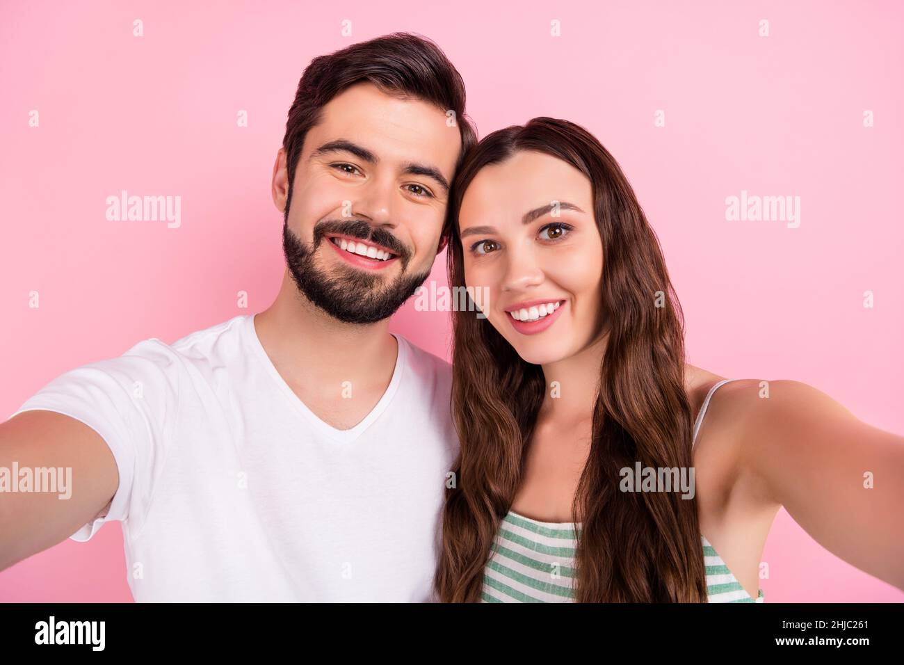 Photo of optimistic young brown hair couple do selfie wear white t ...
