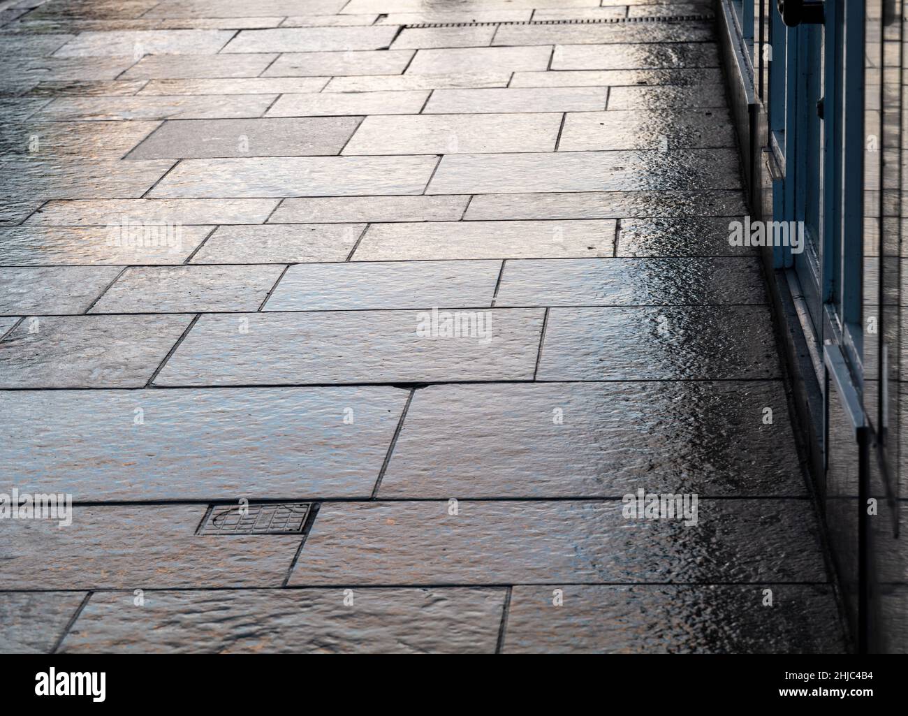 ABERDEEN,SCOTLAND - 24 JANUARY 2022: This is the damp pavement of Union ...