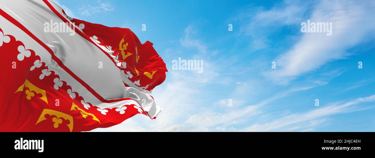 flag of Alsace, France at cloudy sky background on sunset, panoramic ...