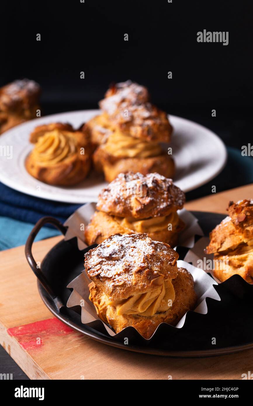 Food concept Homemade Caramel Choux a la cream or Choux cream puffs on ...