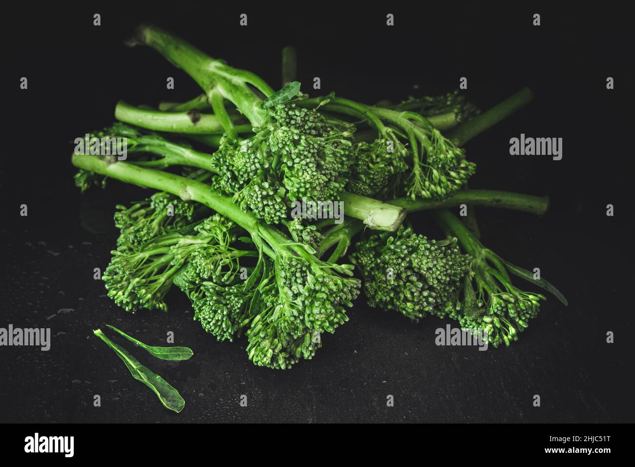 Fresh bimi vegetable on a dark table. Raw baby broccoli Stock Photo - Alamy
