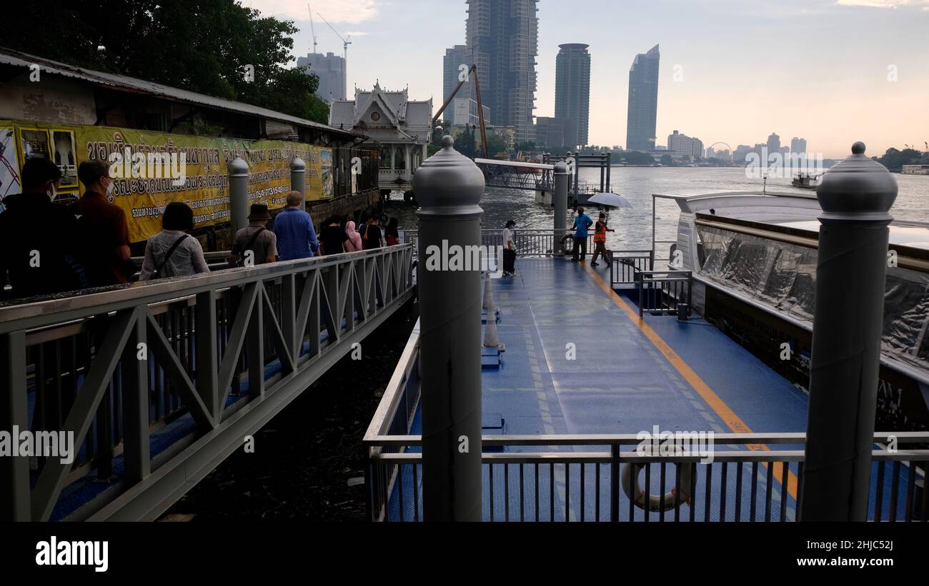 Passengers at Sathorn pier, code/number CEN, on the Chao Phraya River ...