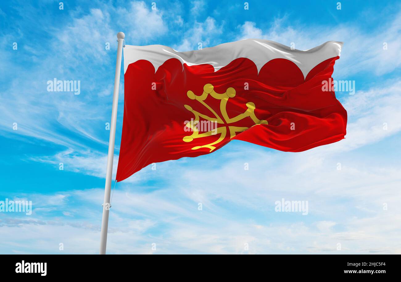 flag of department of Gard, France at cloudy sky background on sunset ...