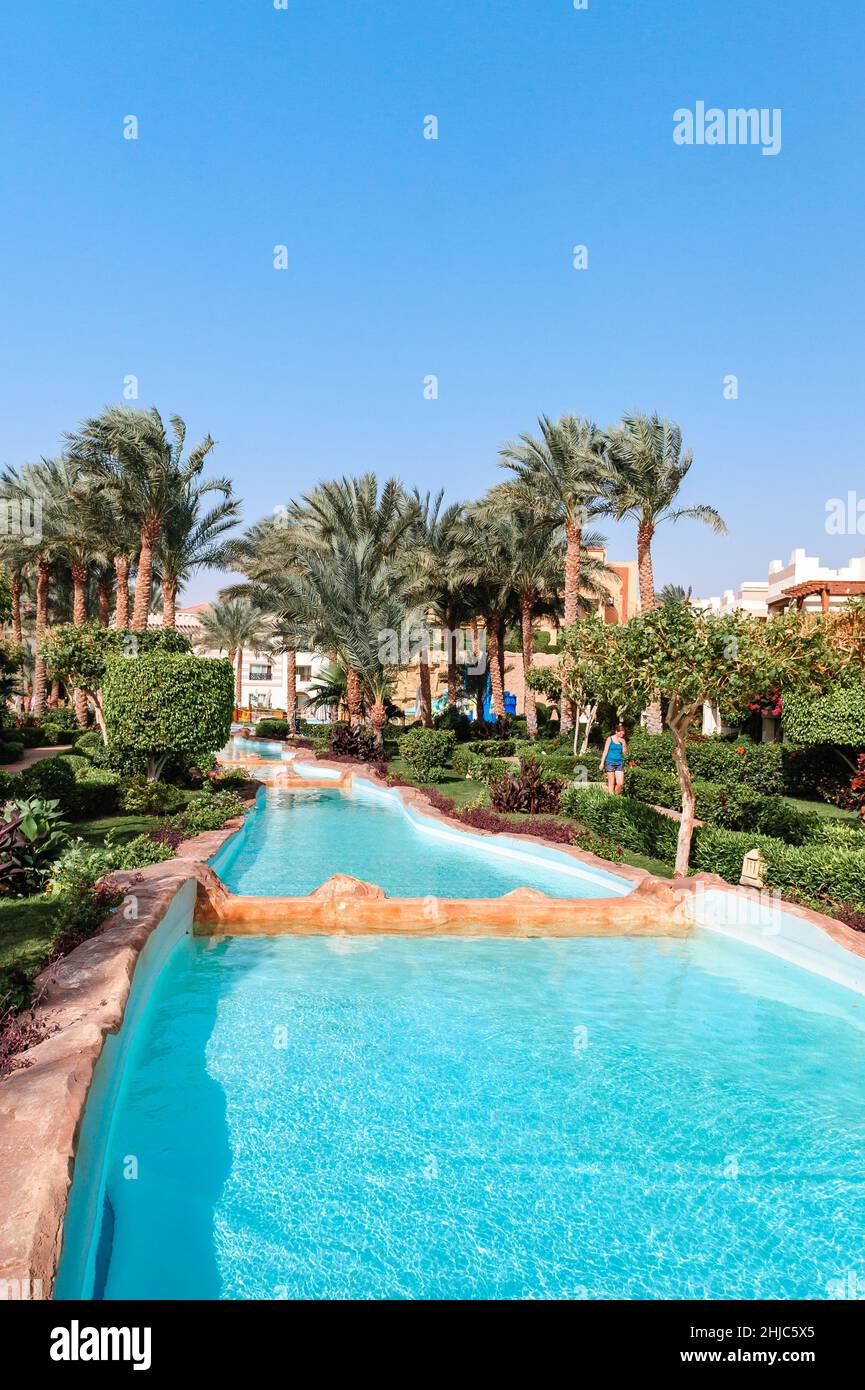 Beautiful swimming pool and palm trees in Egypt Stock Photo - Alamy