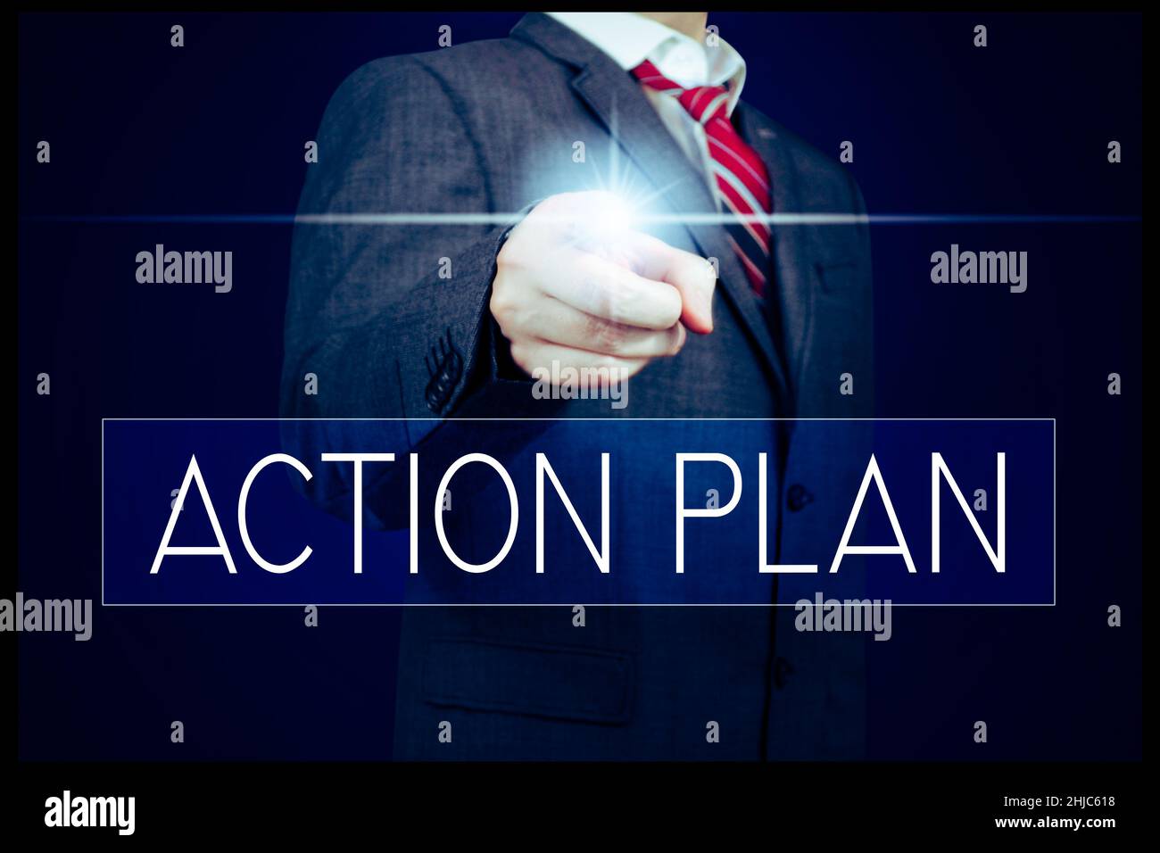 Action plan - lettering, businessman pointing finger Stock Photo - Alamy