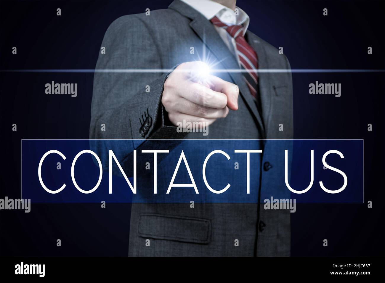 Contact us - lettering, businessman pointing finger Stock Photo - Alamy