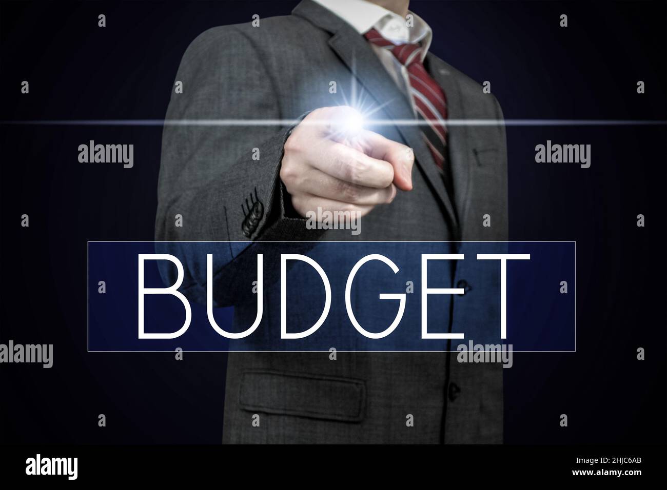 Budget - lettering, businessman pointing finger Stock Photo - Alamy