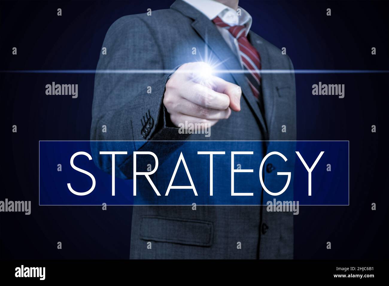 Strategy - lettering, businessman pointing finger Stock Photo - Alamy
