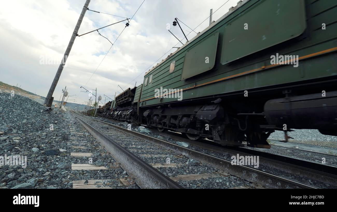 Moving of diesel locomotive and railway cars filled with ore. Quarry ...