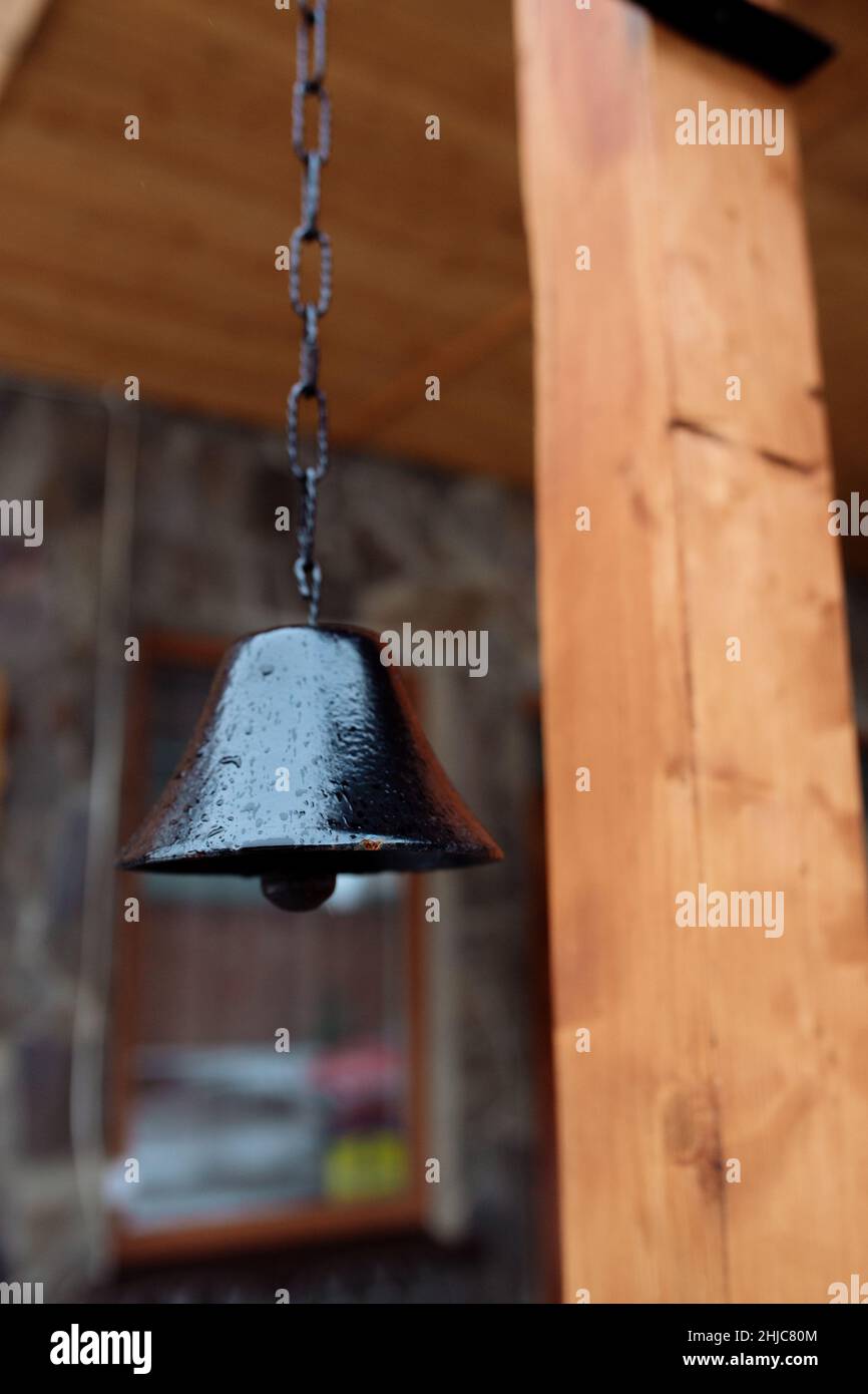 old bell on the facade of the house. The exterior of the building and ...