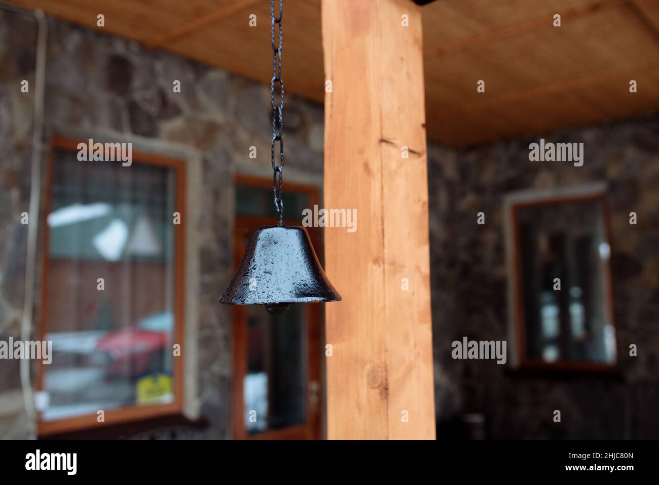 old bell on the facade of the house. The exterior of the building and ...
