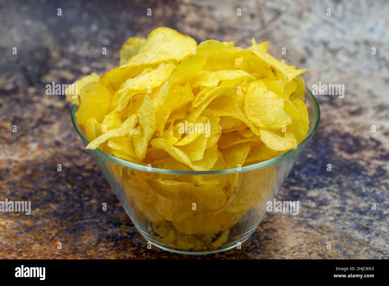 Potato chips or Crispy in a bowl on colorful background. Close up Stock ...