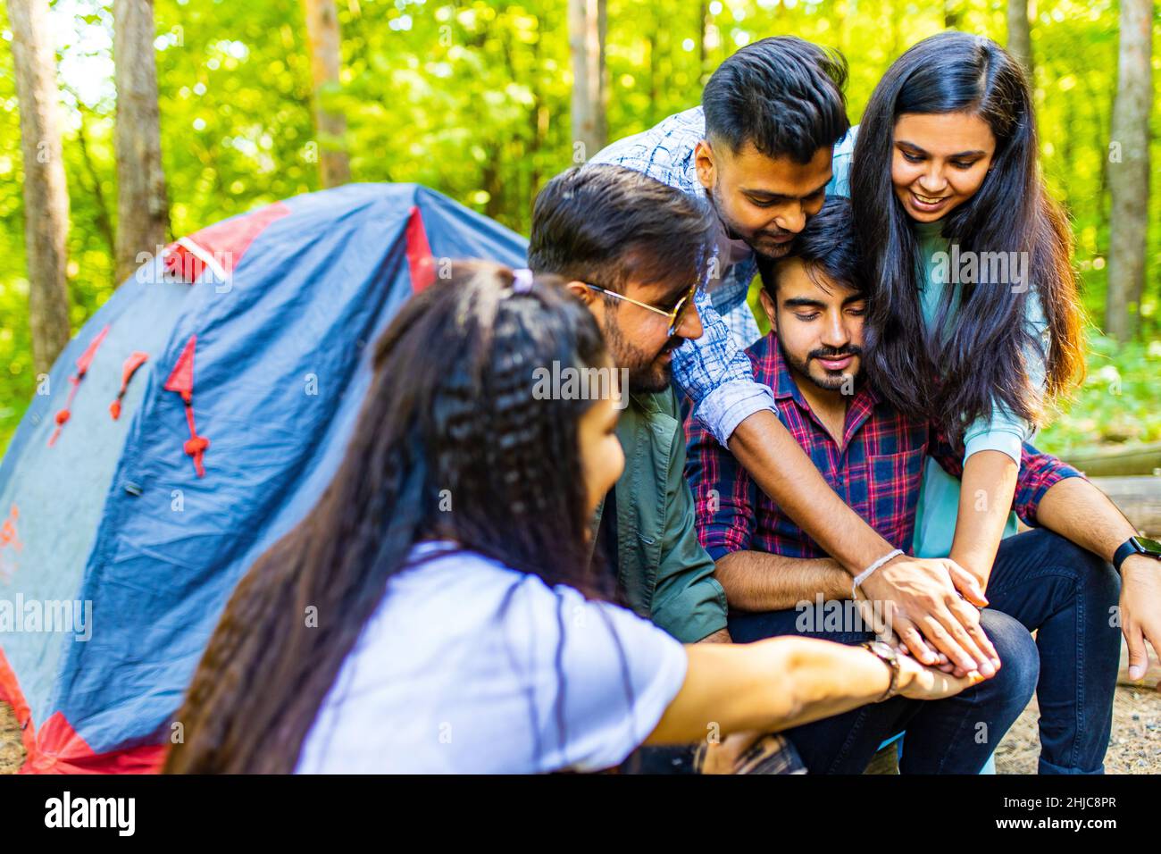 Multiracial pakistanian happy friends at picnic camping park Stock ...