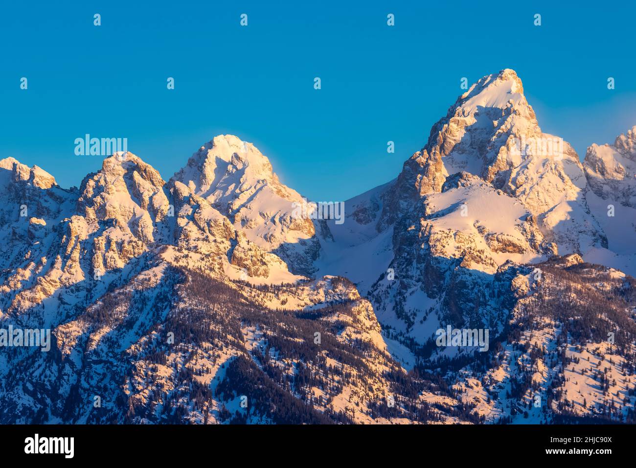Snow-covered Grand Teton and other peaks of the Grand Teton Range in ...