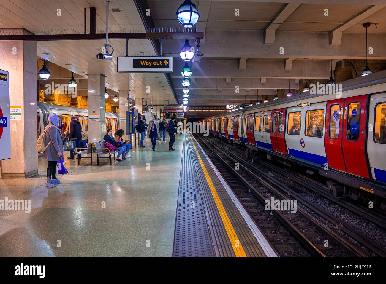 Railway train on Gloucester road station with passengers on platform ...