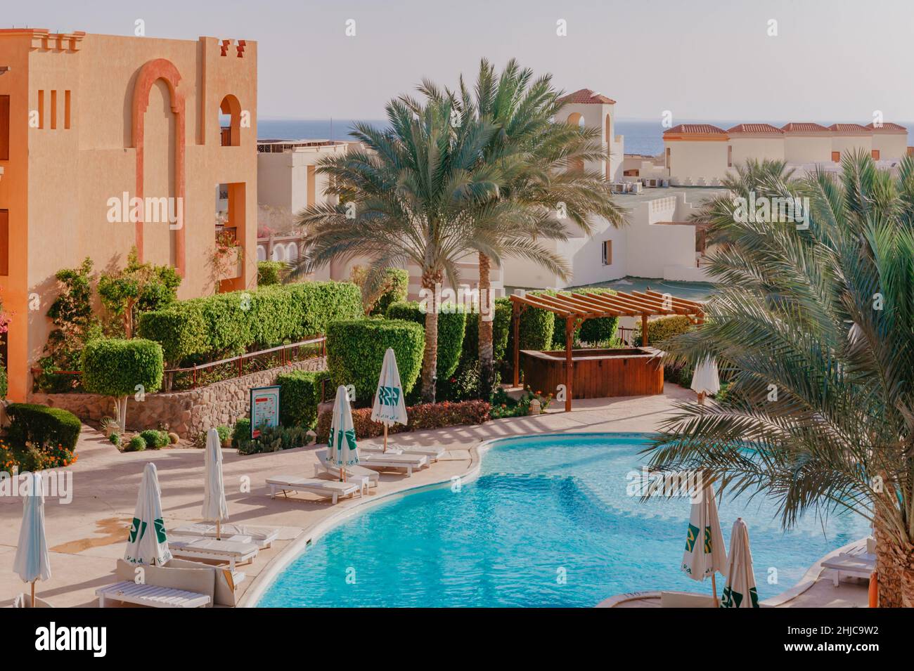 Beautiful swimming pool and palm trees in Egypt Stock Photo - Alamy