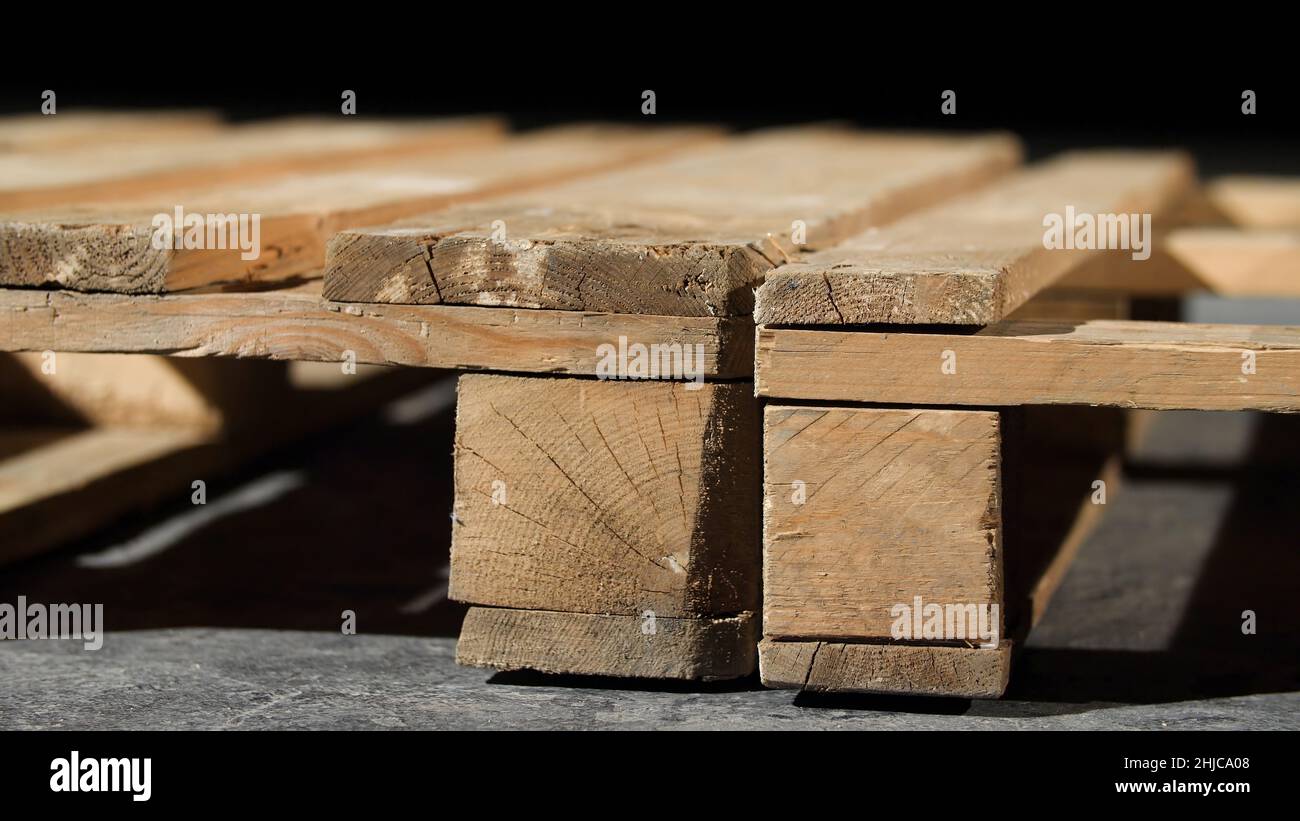 Close-up of wooden pallet. Angle of wooden pallet on grey concrete ...