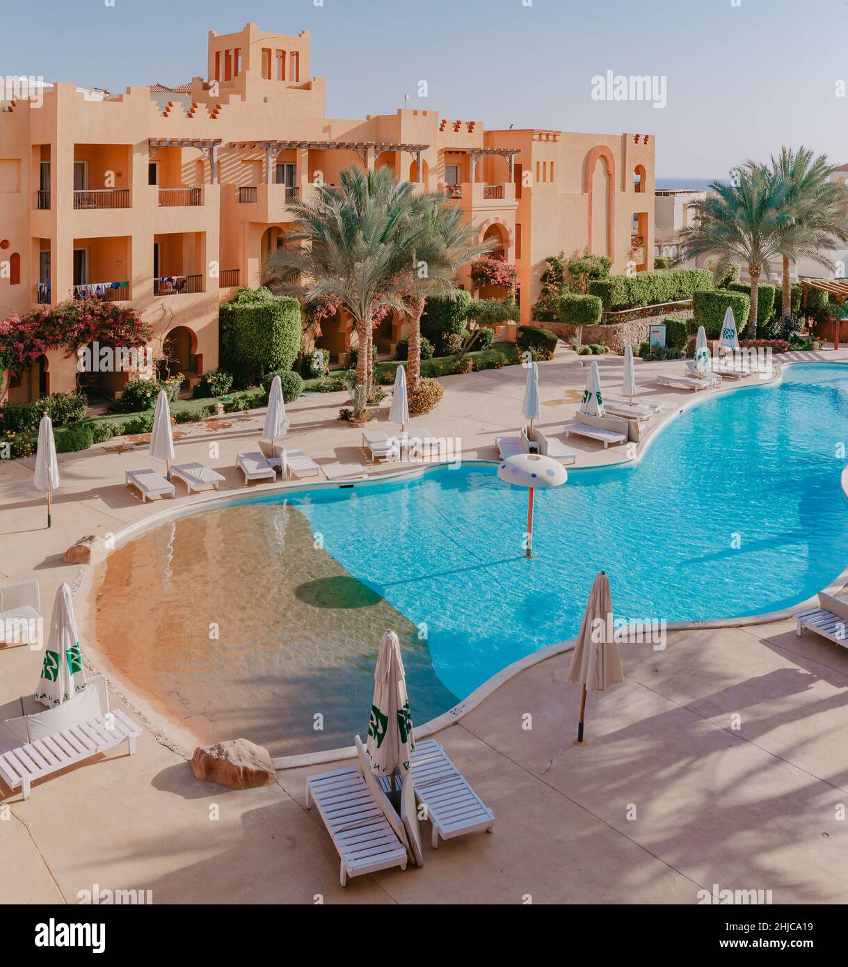 Beautiful swimming pool and palm trees in Egypt Stock Photo - Alamy
