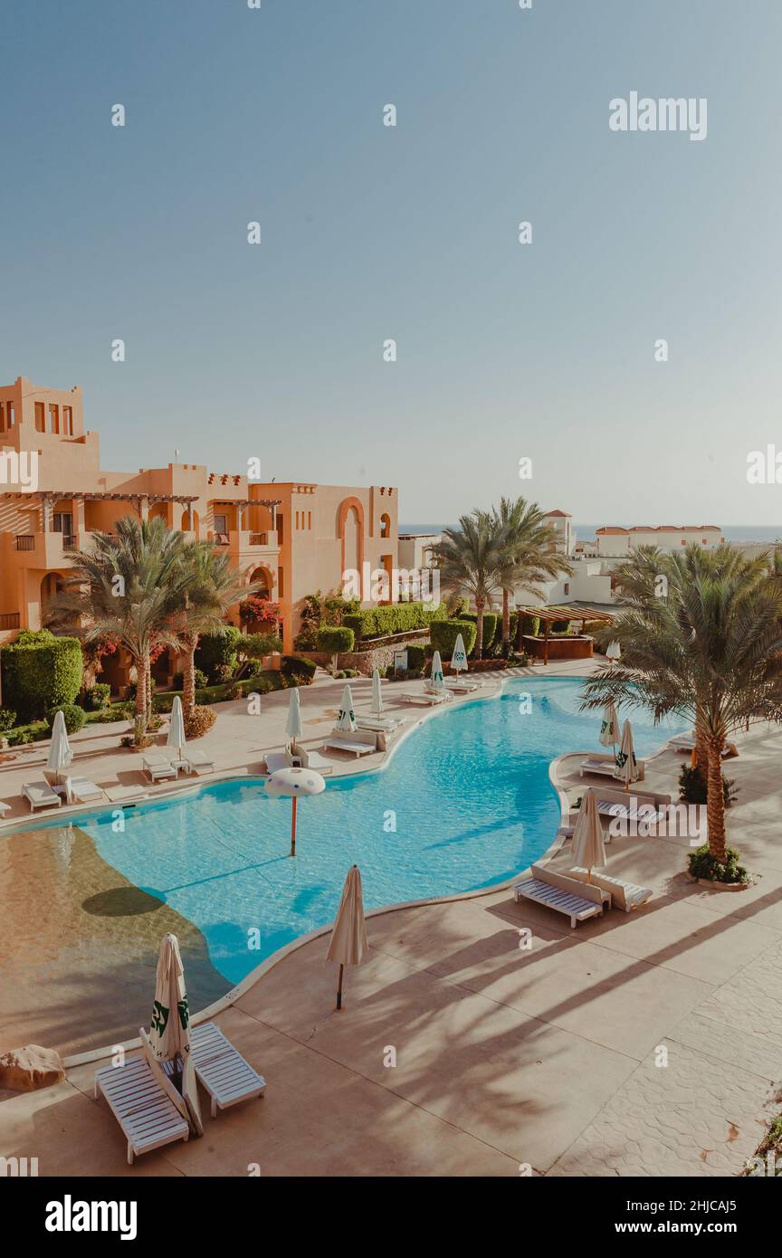 Beautiful swimming pool and palm trees in Egypt Stock Photo - Alamy