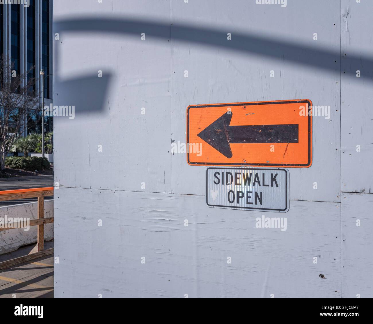 Sidewalk open sign with arrow Stock Photo - Alamy