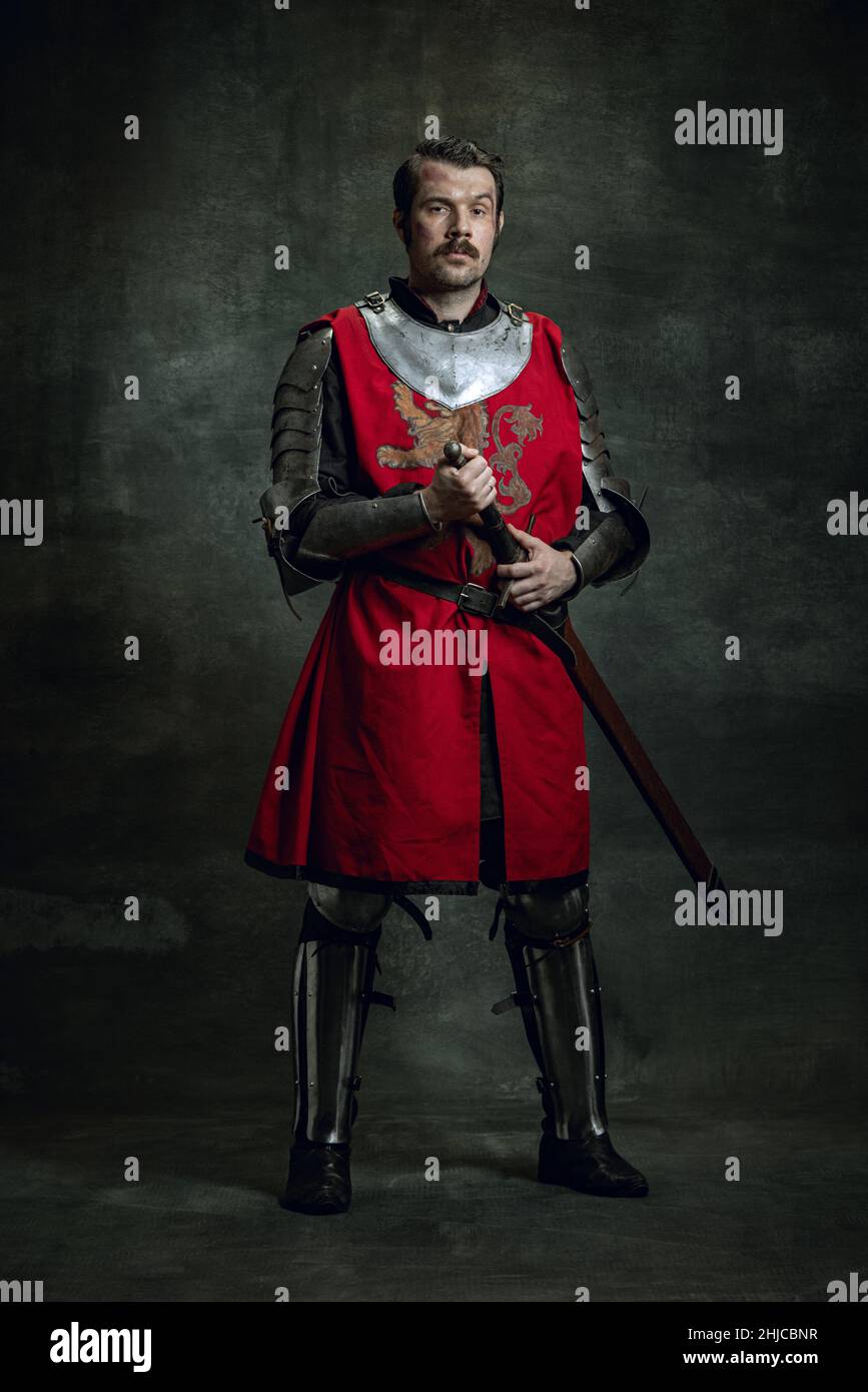 Portrait of brutal seriuos man, medieval warrior or knight with dirty ...