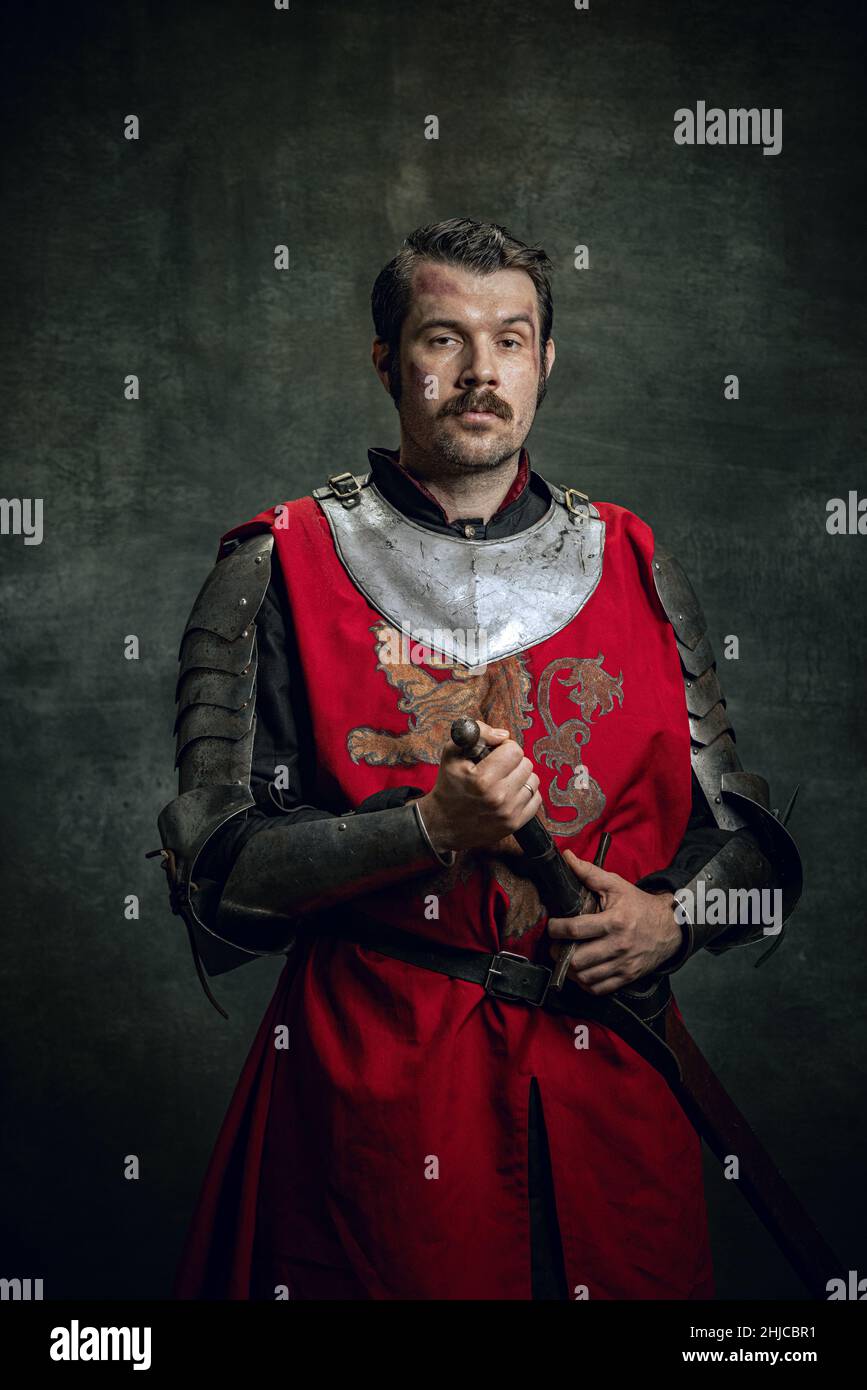 Vintage style portrait of brutal seriuos man, medieval warrior or ...