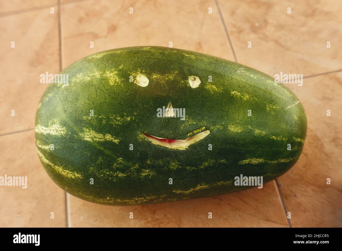 watermelon with smile face, Green watermelon Stock Photo - Alamy