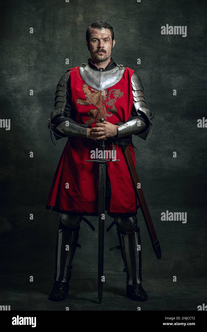 Portrait of brutal seriuos man, medieval warrior or knight with dirty ...